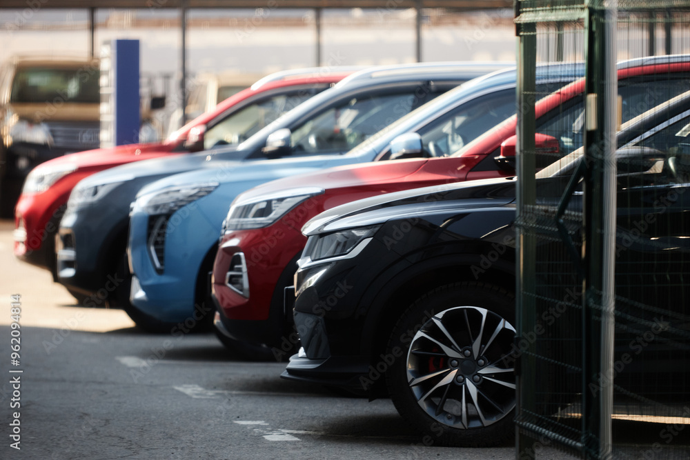 Side view of demo cars of various models and colors displayed in ...