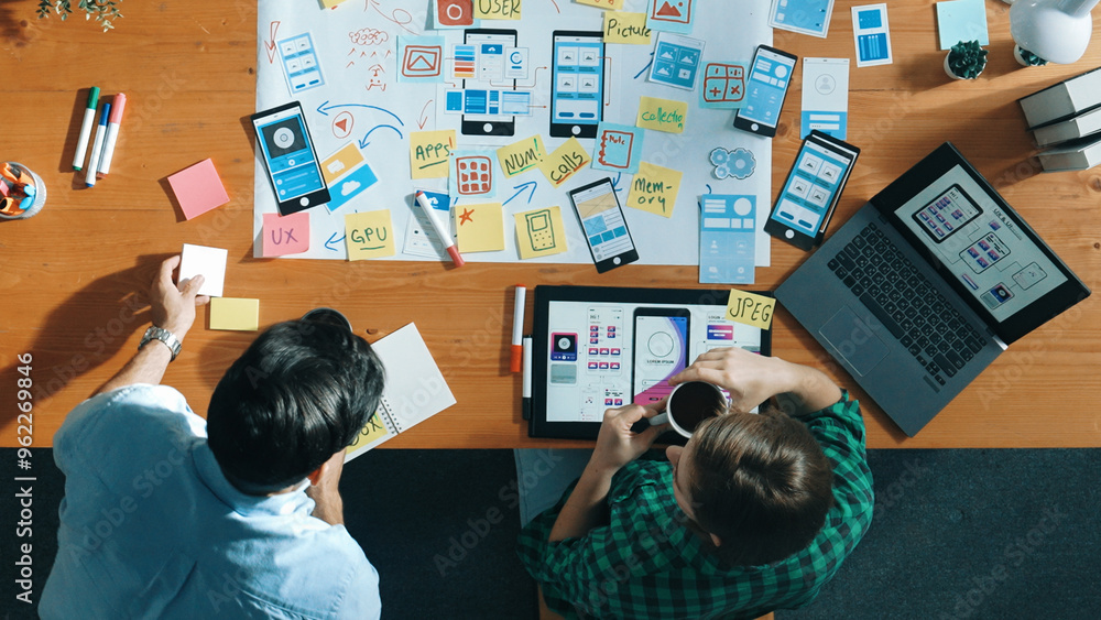 Top view of smart manager working together to develop Ux Ui design for ...