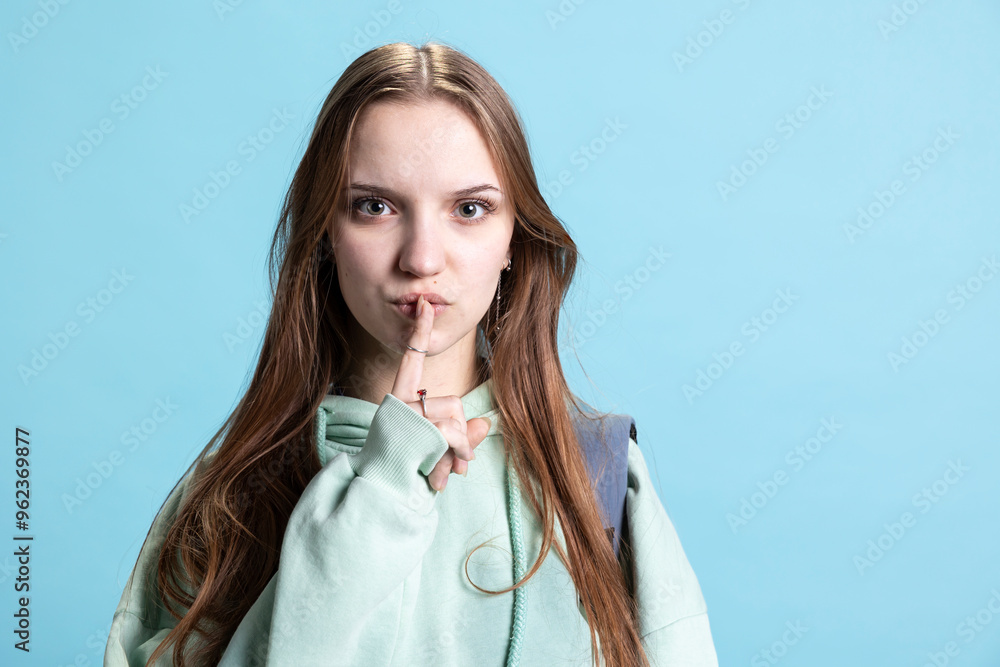 Upset young teenager doing shushing hand gesturing, irritated by loud ...