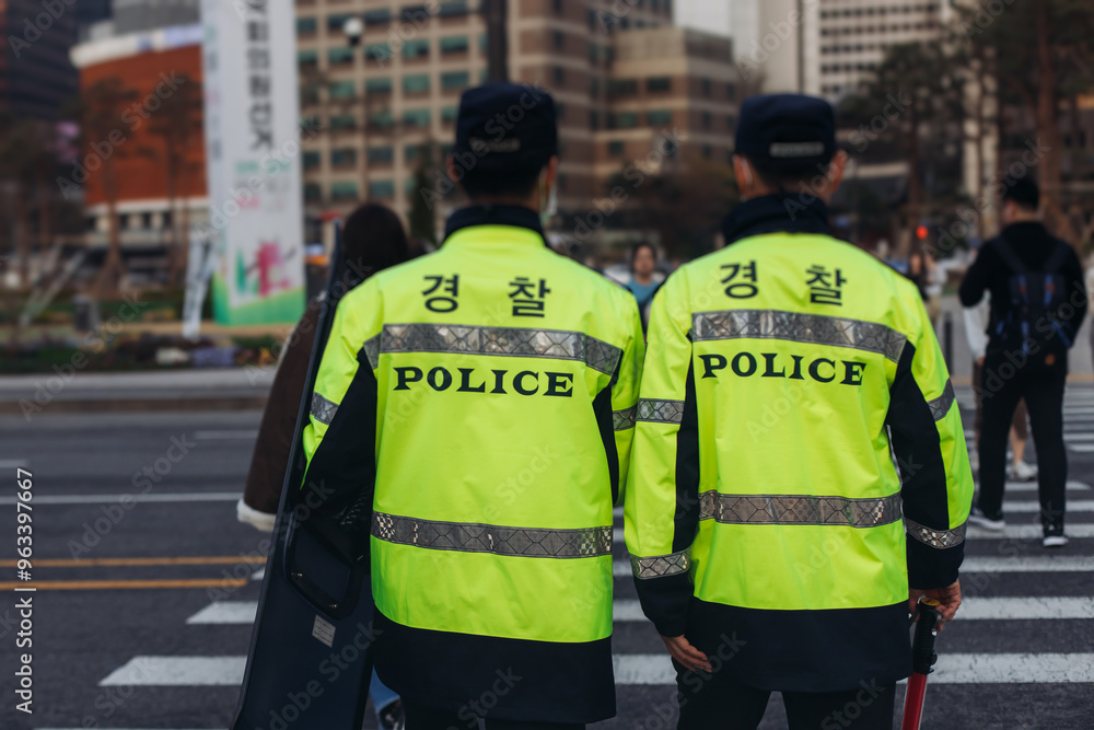 Korean police squad formation in protective uniform with "Police" logo ...