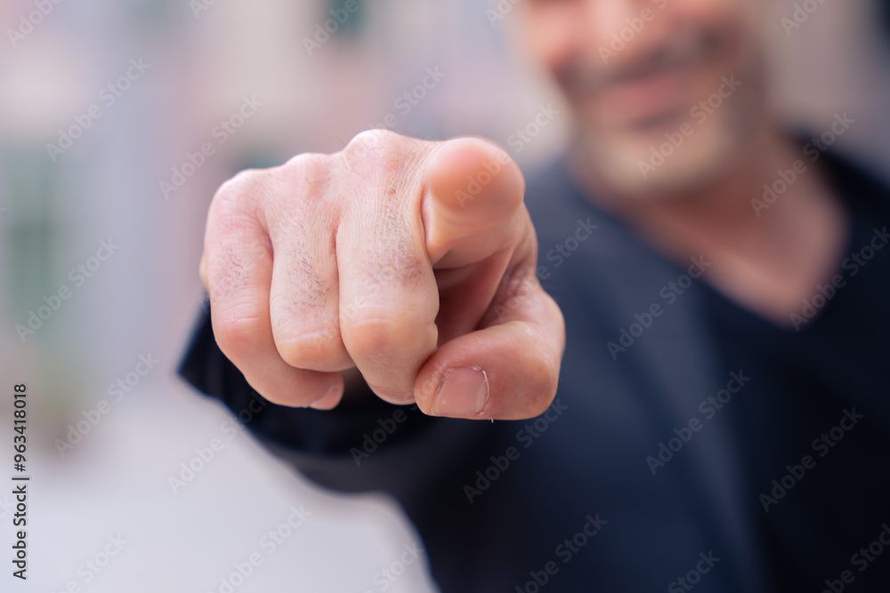 Unrecognizable middle adult pointing finger to front of logo. Smiling ...