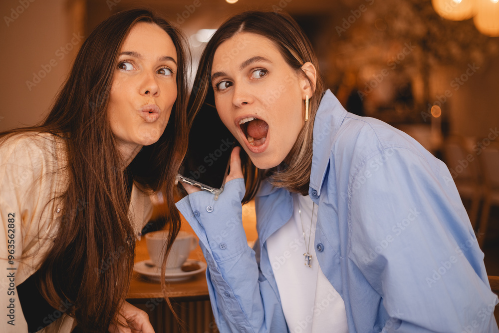 Shocked beautiful young woman overhearing conversation of cheerful ...