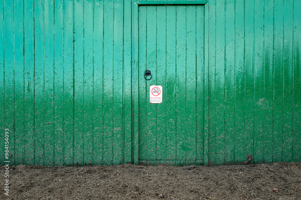 Closed wooden door at the entrance to a race horse stables in the ...