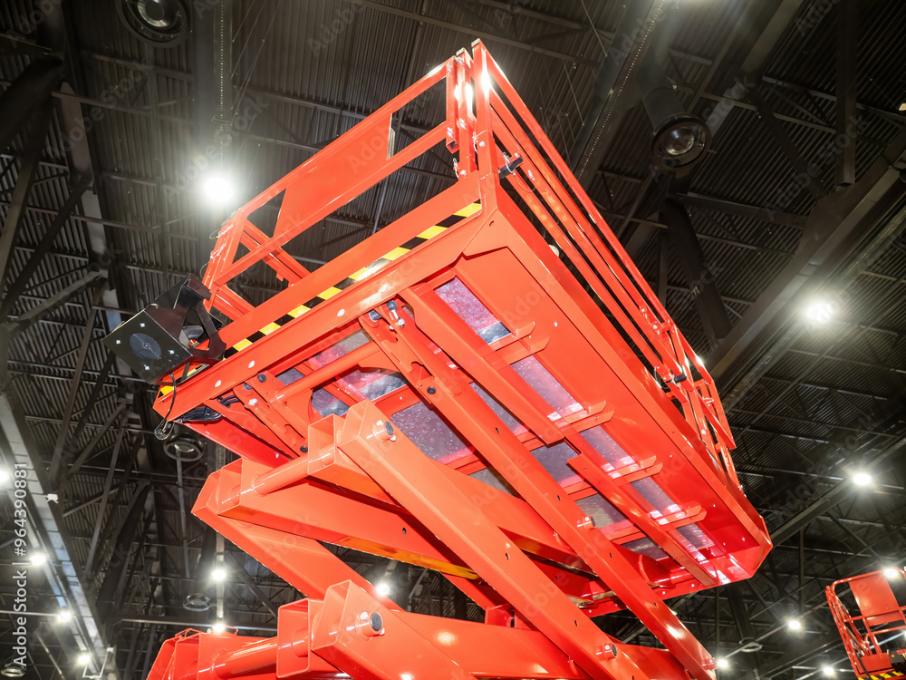 Scissor lift in industrial building. Basket for builders working at ...