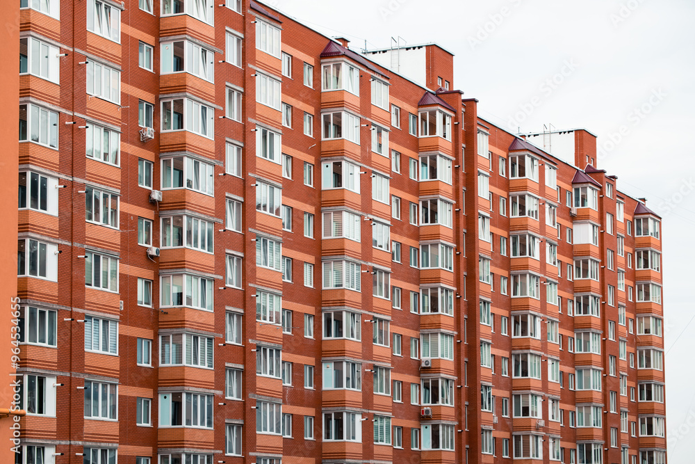 huge multi flat building for many people brick exterior long facade ...