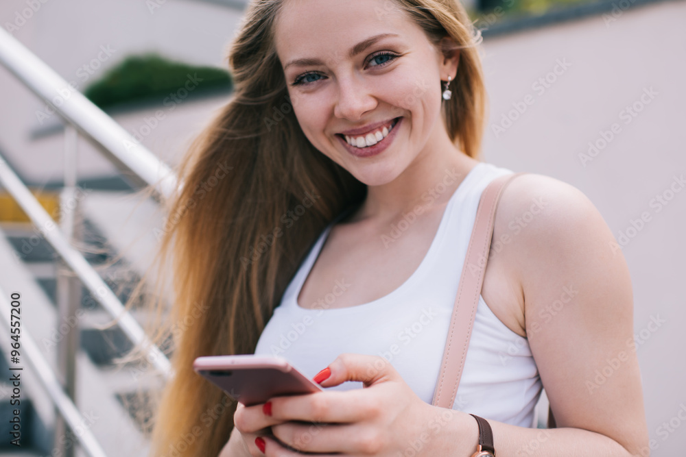 Half length portrait of millennial mobile blogger holding cell gadget ...