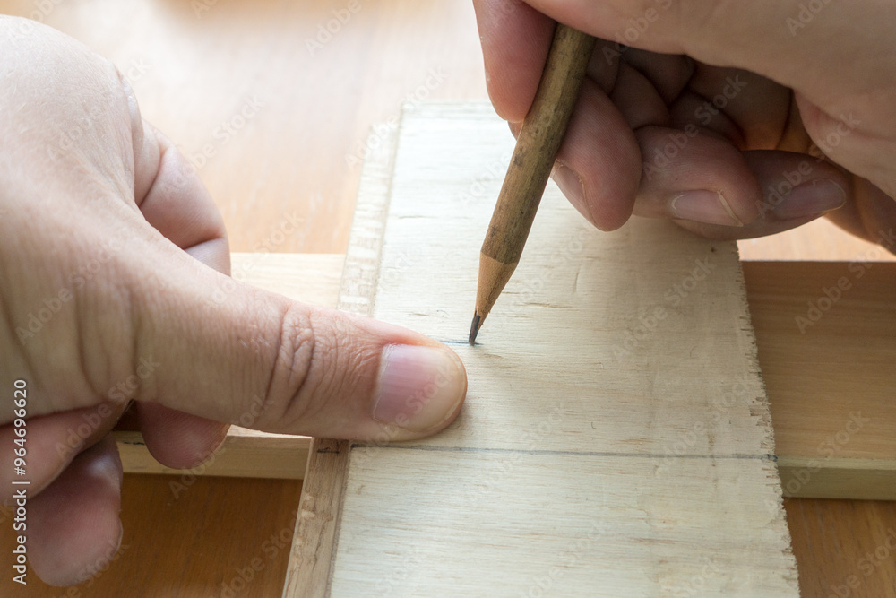 Visualization of the concept "rule of thumb", making a mark on wood ...