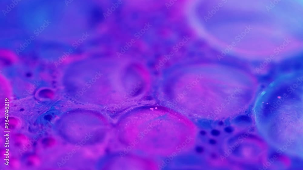 Oil bubbles. Serum gel. Defocused neon purple pink blue color glitter ...