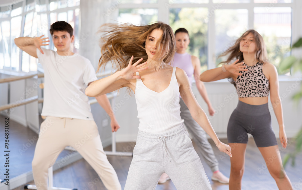 Girl repeats and teaches sequences of movements and actions during ...