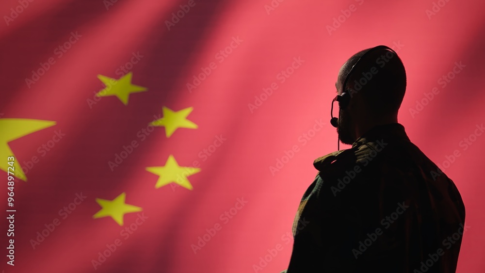 Military dispatcher working for Chinese army relaying info for troops using headset. Radio ...
