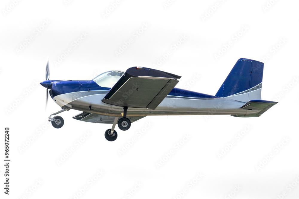 Fly by in a small aircraft. Blue and gray paint on a low wing airplane ...