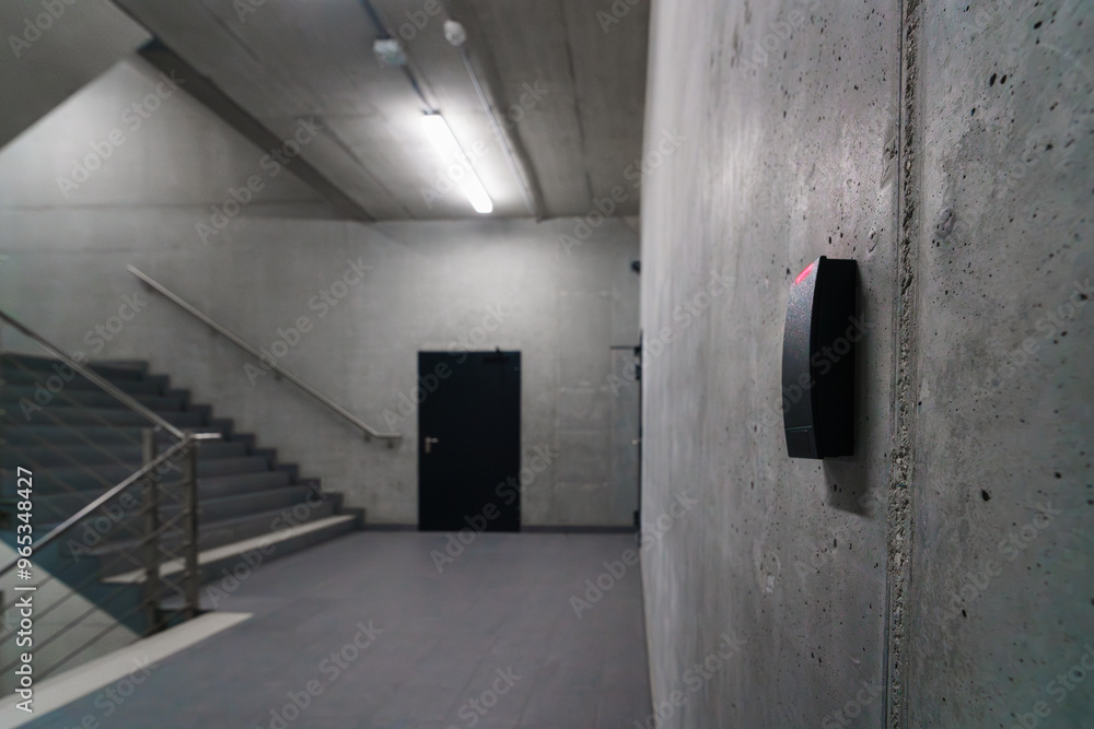 Access card reader gray concrete staircase wall. Office background real ...