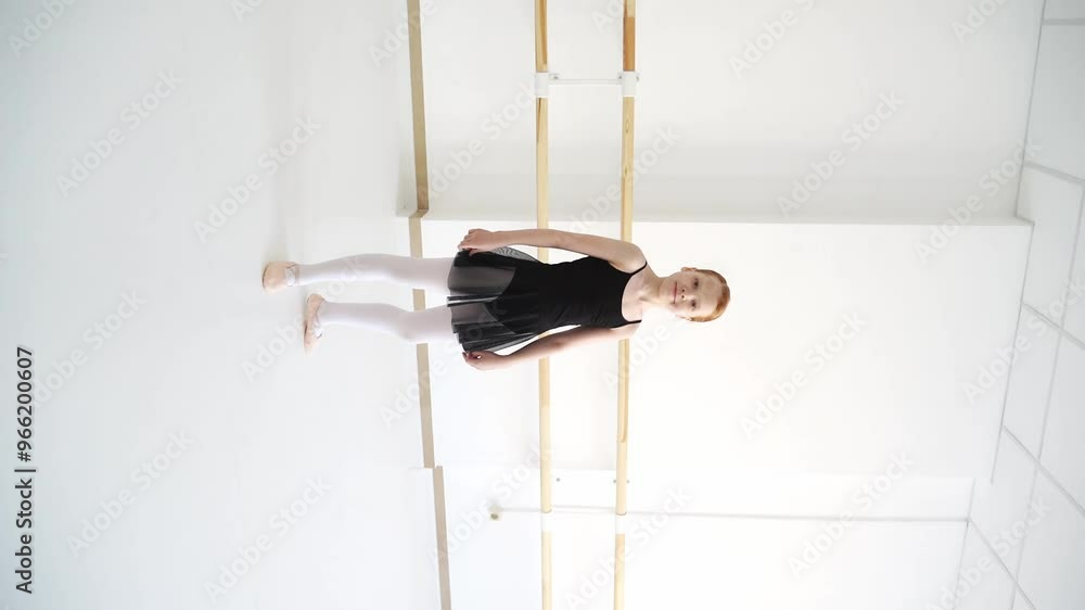 Young ballet girl at studio lesson. Training performance. Stretching ...