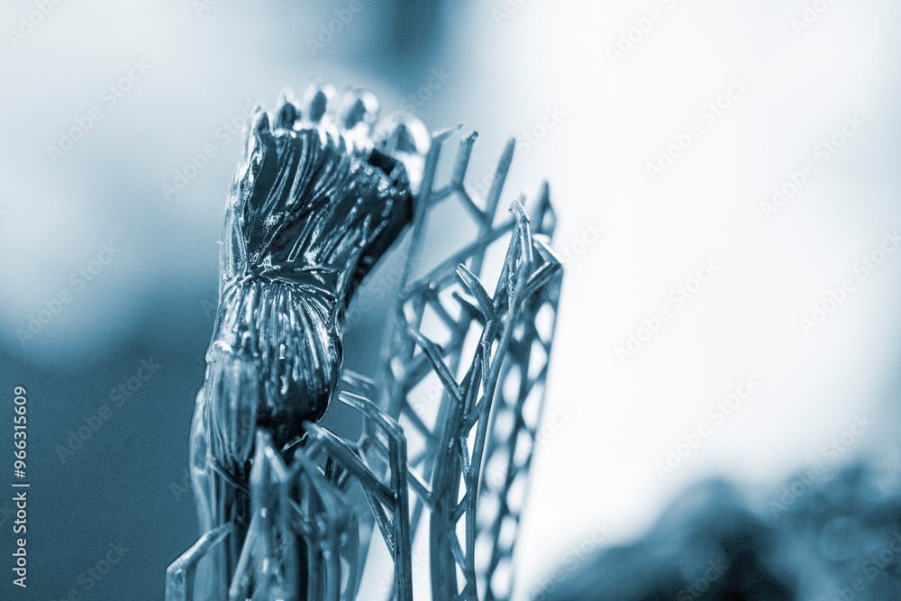 Model of leg printed on a 3D printer from black rubber, close-up. Part ...