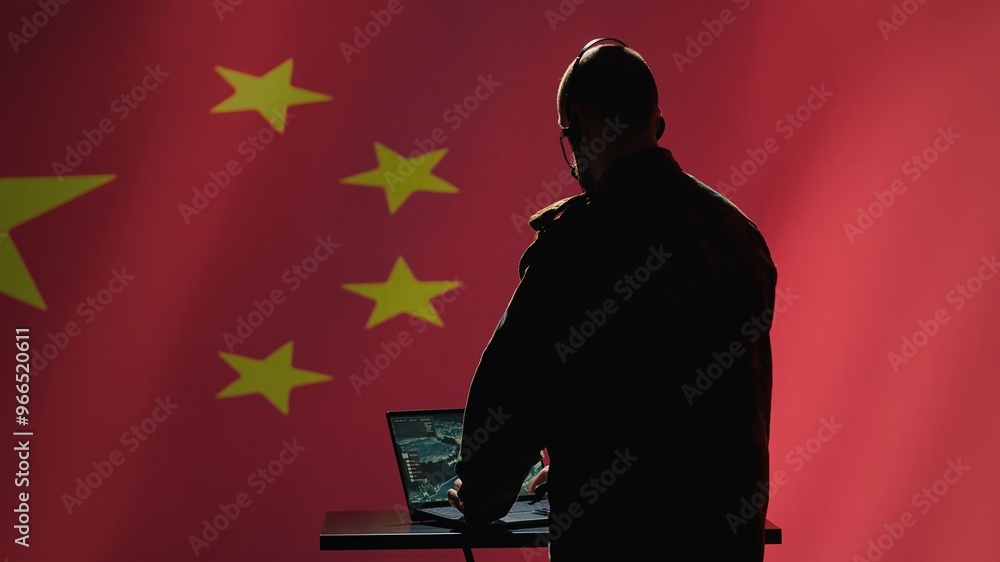 Chinese army communication systems operator using radio and satellite equipment, providing ...