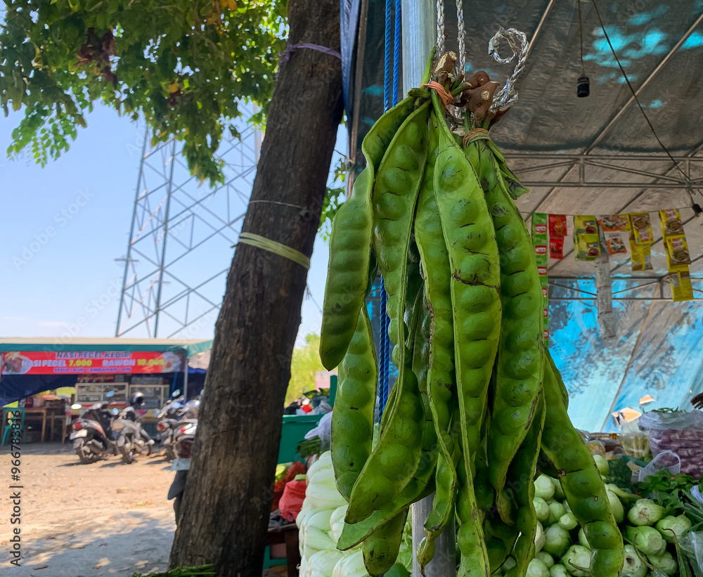 Pete or petai hanging in traditional markets are usually a ...