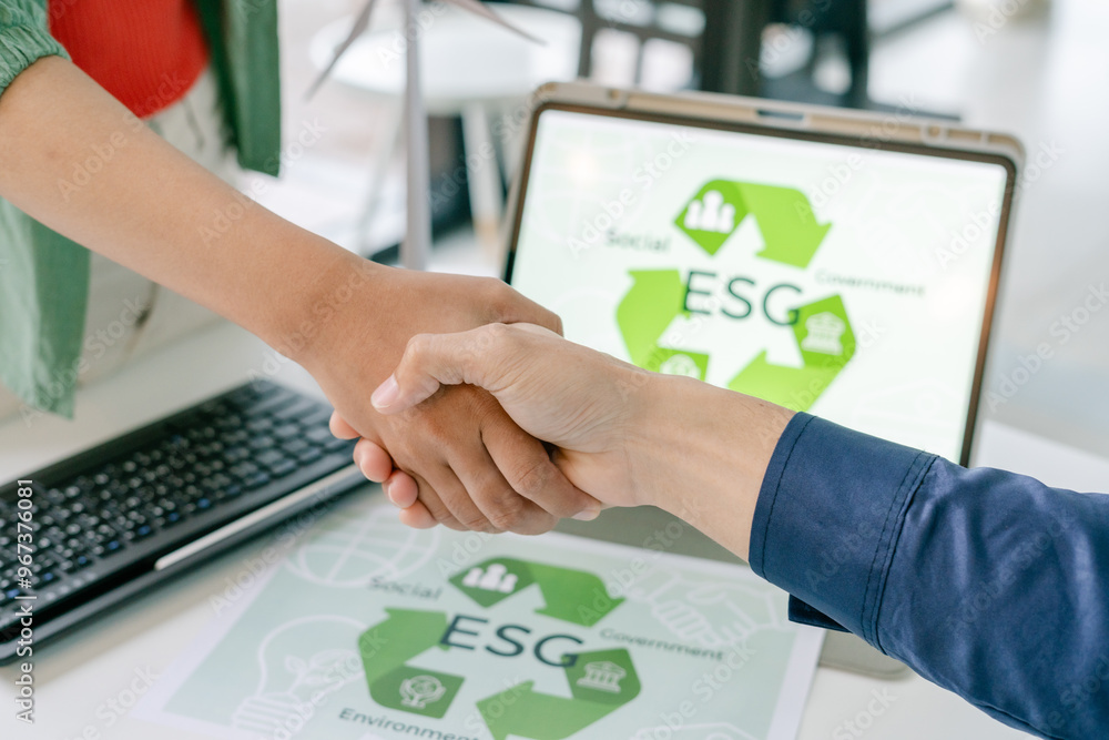 Closeup businesspeople shaking hands over ESG Environmental, Social ...