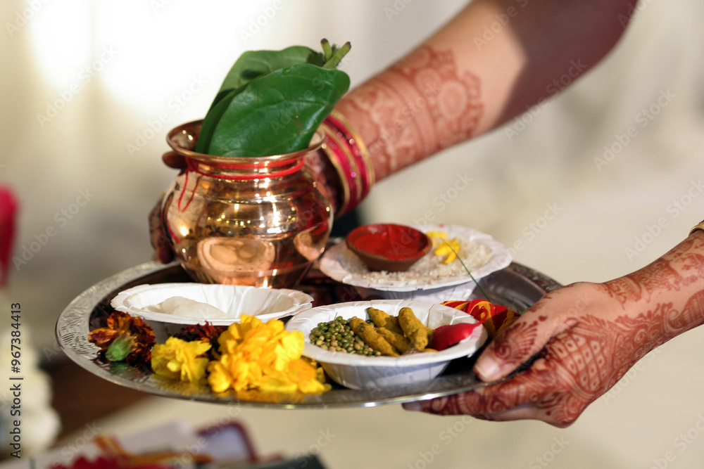 Indian pooja thali is a decorated plate used for rituals, containing a ...