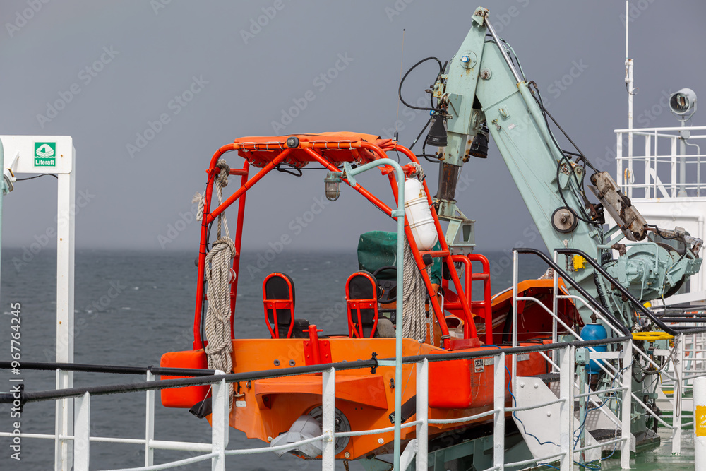 Life boat on a ferry, Image shows a lifeboat secured to the top deck of ...