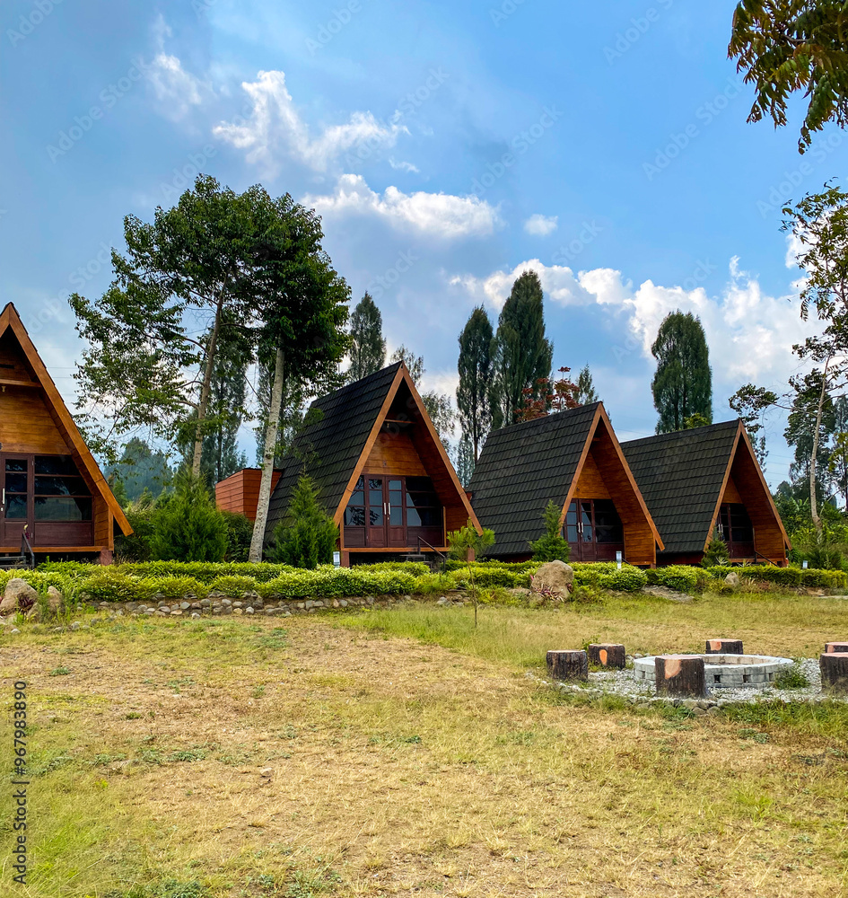 Charming wood framed cabin with gravel driveway leading to the entrance ...