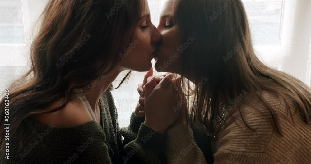 The women approach each other, touch each other tenderly and ...