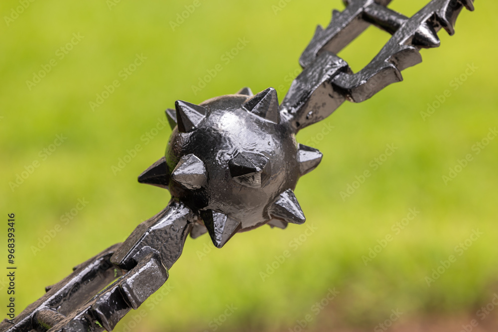 Metal chain from a fence at Flagler College with a ball and spikes ...