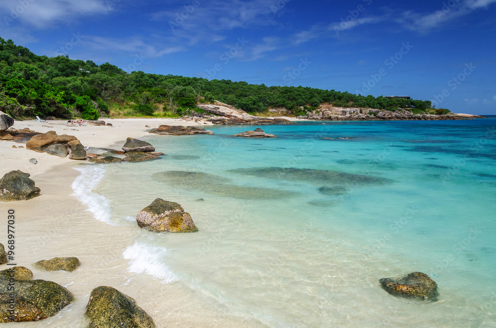 Picturesque tropical golden sandy Sunset Beach with turquoise water on ...