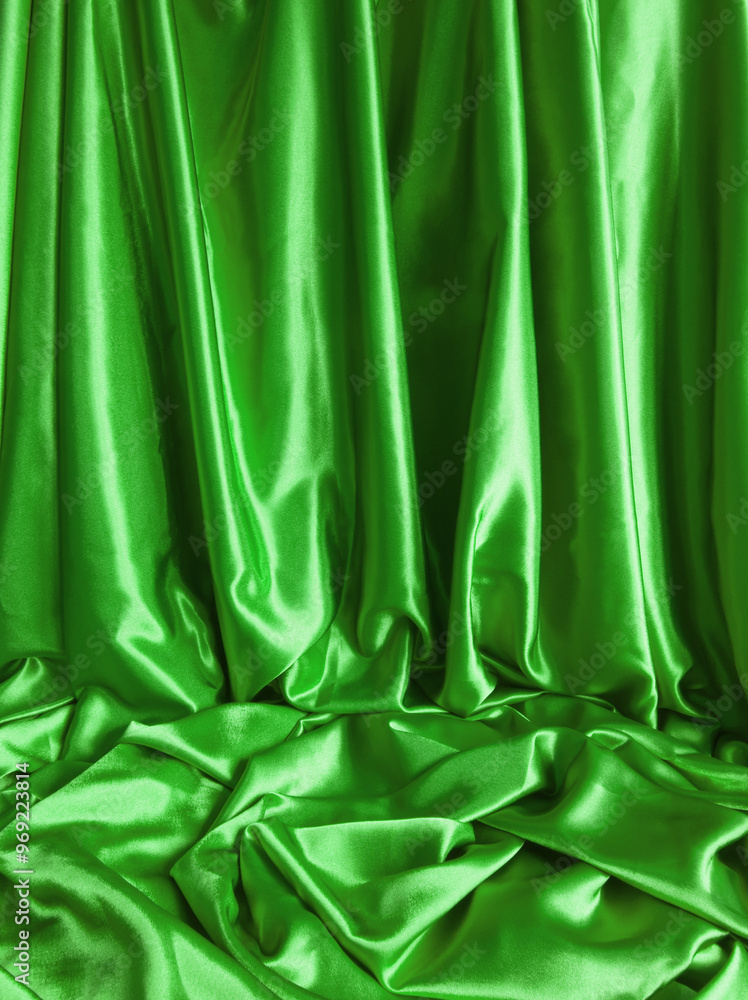 Elegant smooth green satin, silk fabric drapes. Luxurious cloth textile ...