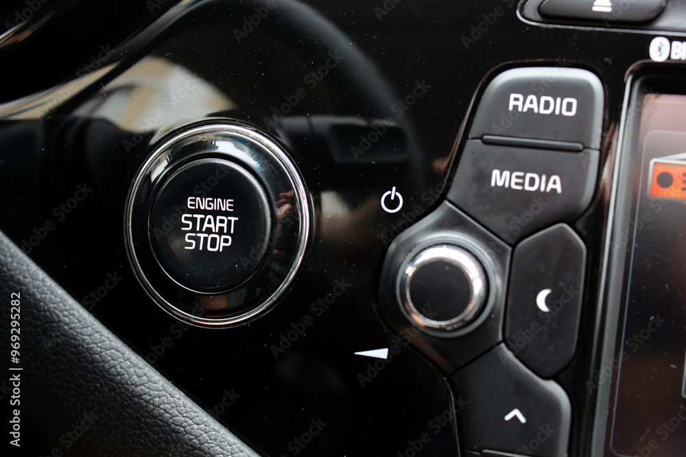 Car Push to Start Button. Close-up black start-stop button on dashboard ...
