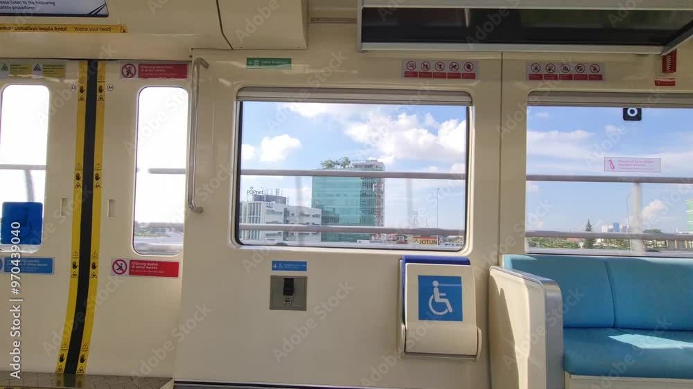 Jakarta, Indonesia on April 7 2024. Empty Jabodebek LRT train seats. The train is moving, the ...