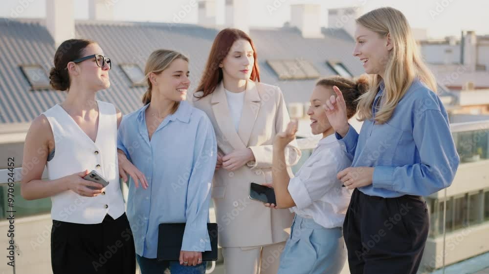 A diverse group of ambitious young professional women gathers on a ...
