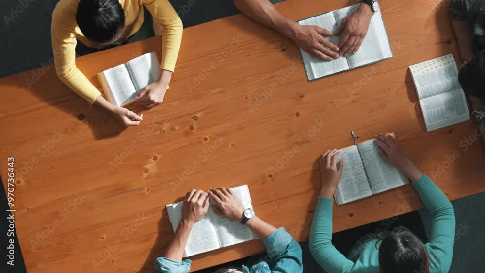 Top view of prayer hold each other support while prays to god at table ...