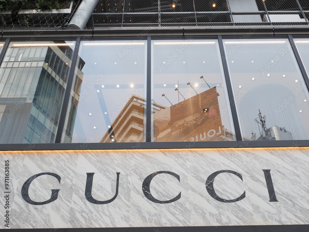 TOKYO, JAPAN - August 22, 2024: Sign on the front of a Gucci store in ...