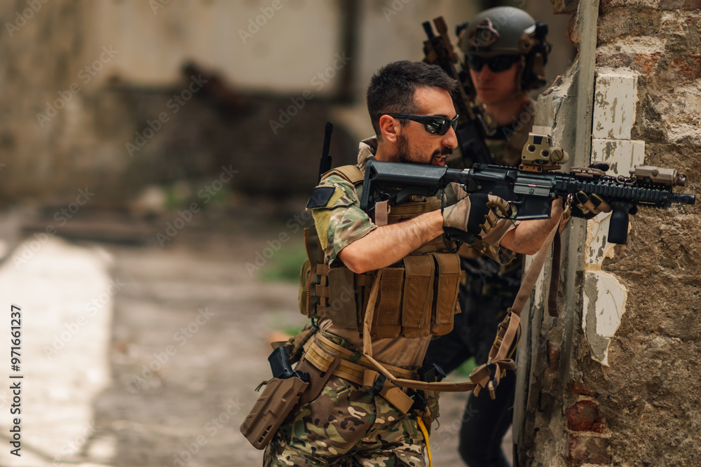 Few brave soldiers with rifles in action during rescue operation. Stock ...