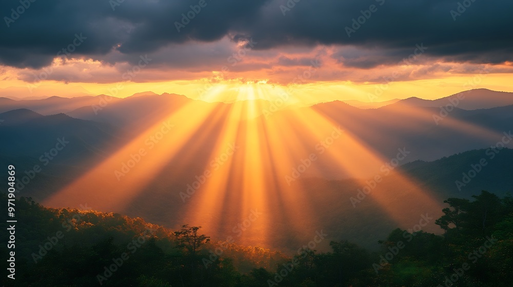 Golden light rays shining down to mountains Sun rays over valley Sun ...