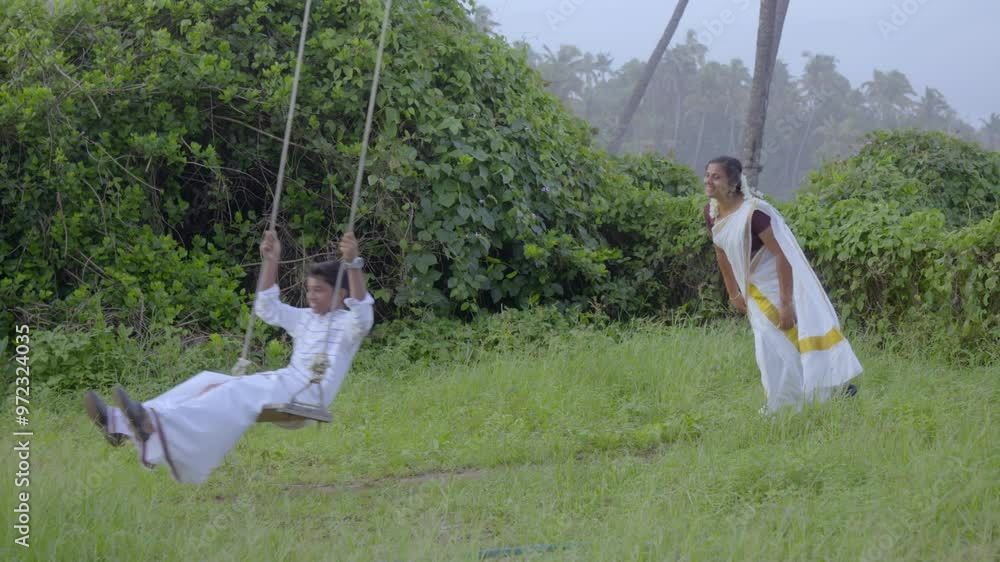 Onam traditional swing in Kerala called oonjal attam is traditional family entertainment during ...