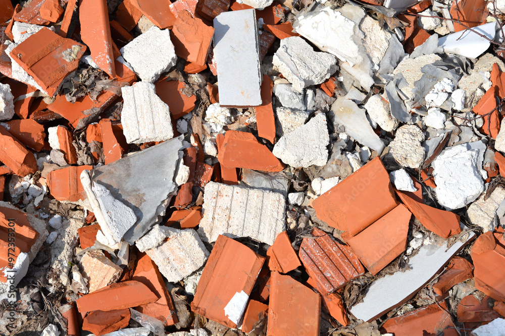 Top-down view of ground covered with rubble and broken bricks and tiles ...