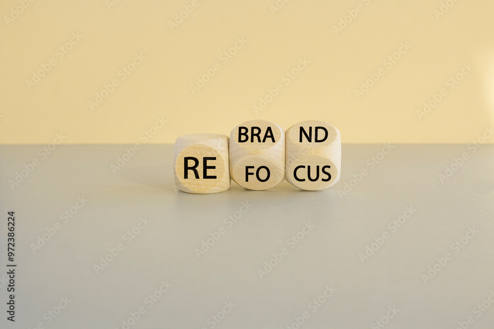 Refocus and rebrand symbol. Turned wooden cubes and changed the word ...