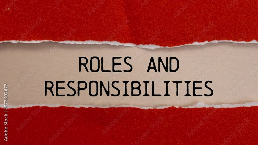 Roles and responsibilities message writing on ripped red torn paper on ...