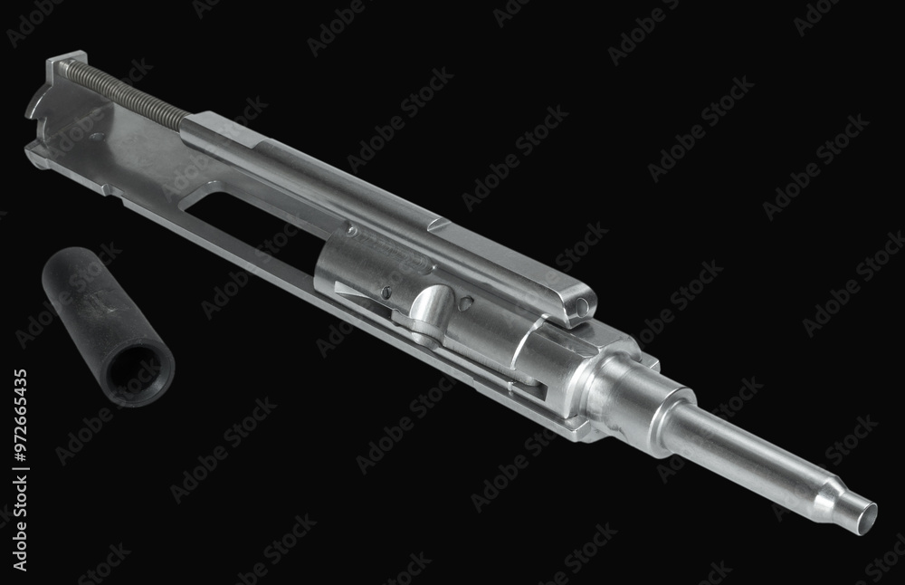 Kit to replace the bolt carrier group in an AR-15 on a black background ...