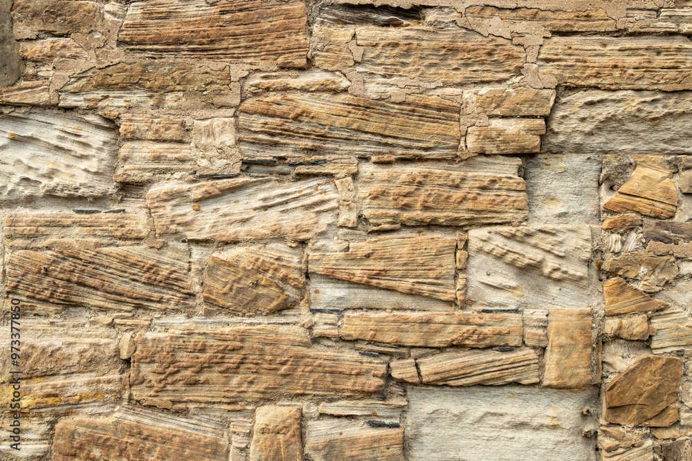 Photo & Art Print Yellow sandstone block and mortar wall with ...