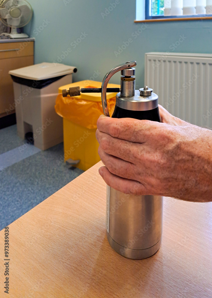 Medical doctor using Liquid Nitrogen (LN2) Spray Jet Dispenser to ...