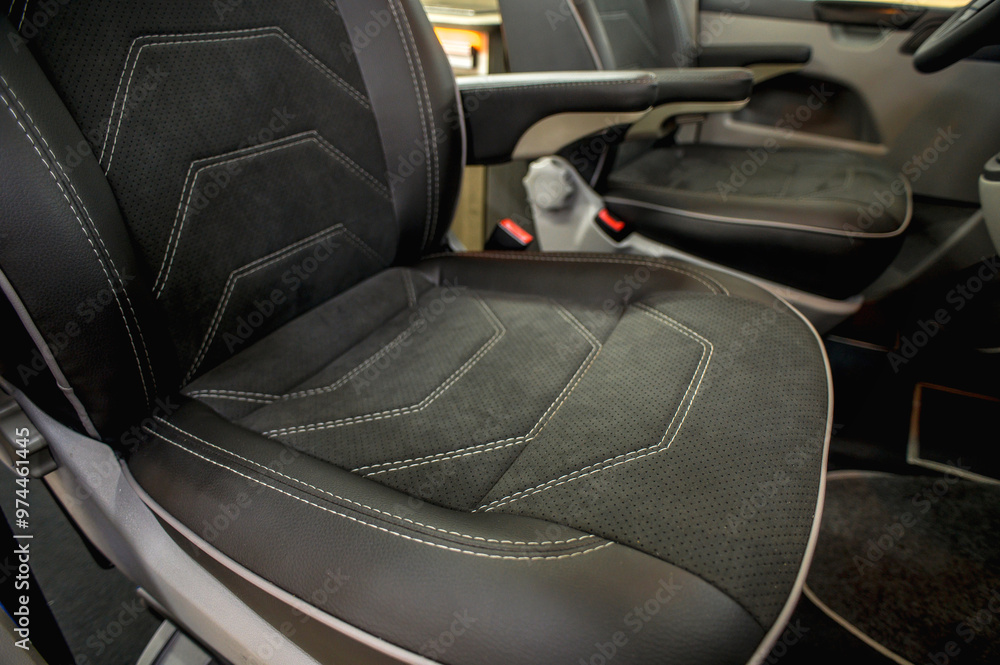 Comfortable interior of a passenger bus with soft seats. The design is ...