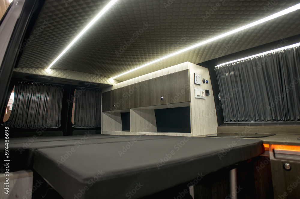 Comfortable interior of a passenger bus with soft seats. The design is ...