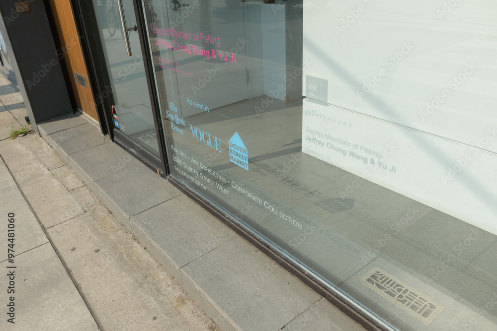 exterior window display with vinyl lettering signage at Gallery House ...
