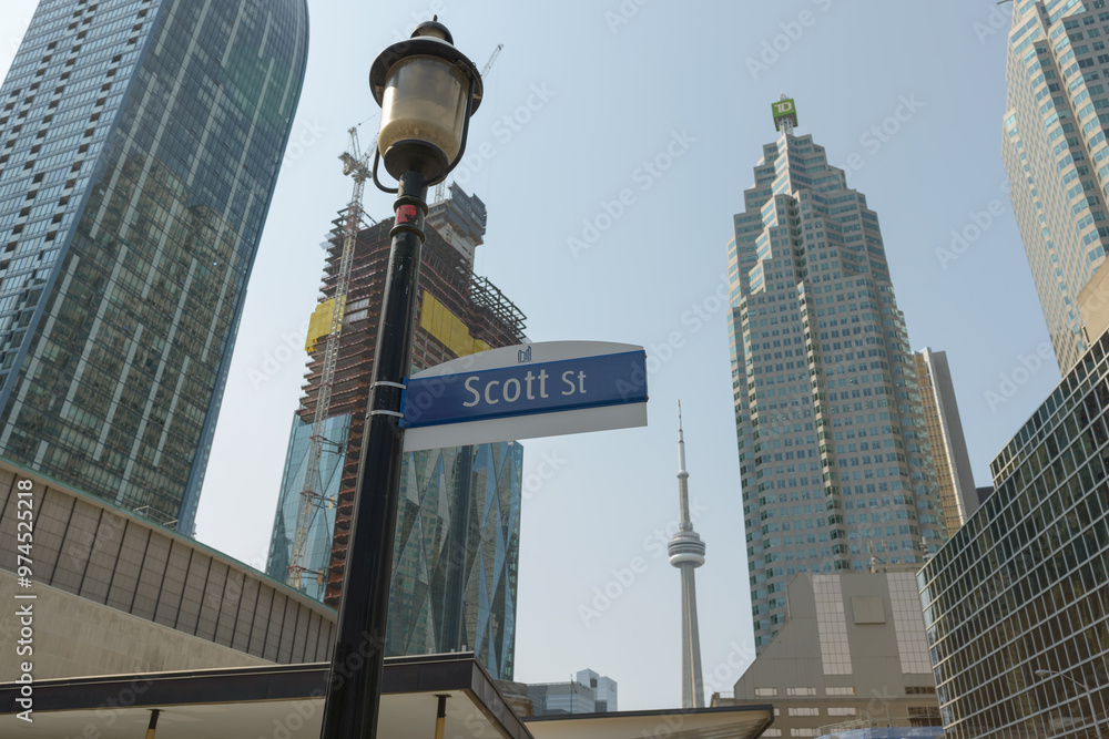 City of Toronto road sign at Scott Street fixed to a lamp pole with a ...