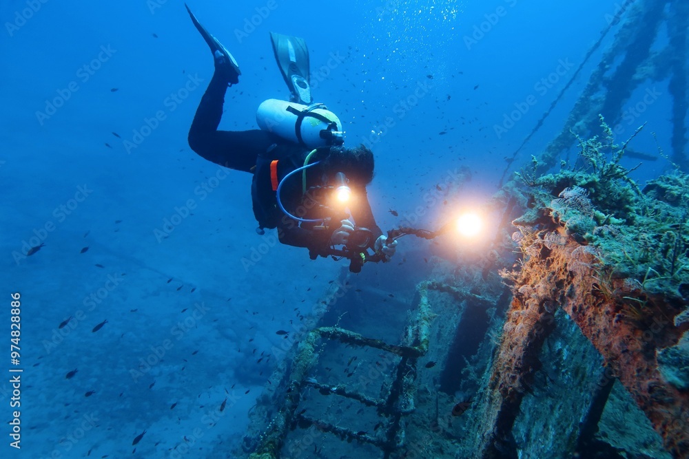 Sunken wreck and scuba diver. Travel photo, diver and shipwreck. Deep ...