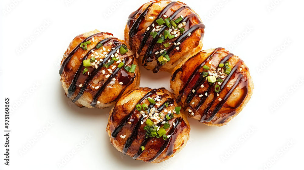 Four round Japanese street food snacks topped with sauce, sesame seeds ...