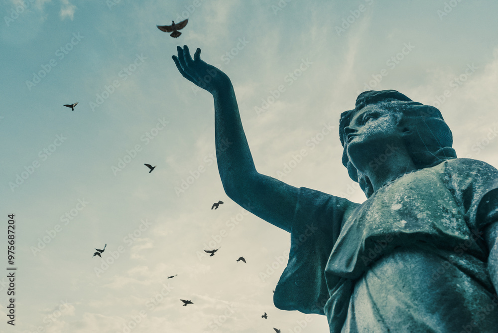 Gothic, romantic and spooky statue with arm elevated showing the way ...