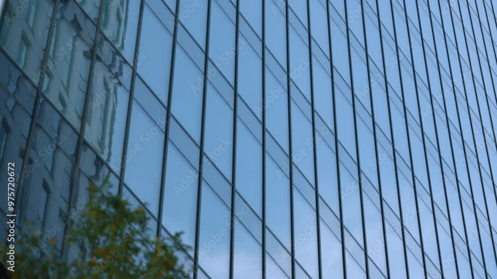 Close-up high rise skyscraper glass facade windows grid dolly shot ...